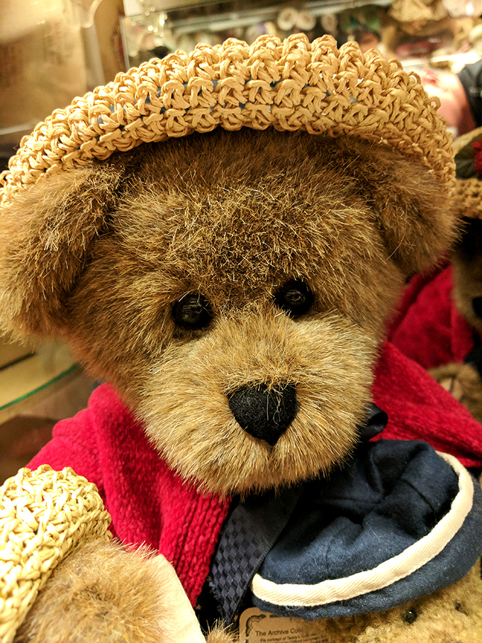 This dapper teddy bear looks like he's waiting for his Paddington moment. The straw hat adds a touch of Gatsby-era elegance.