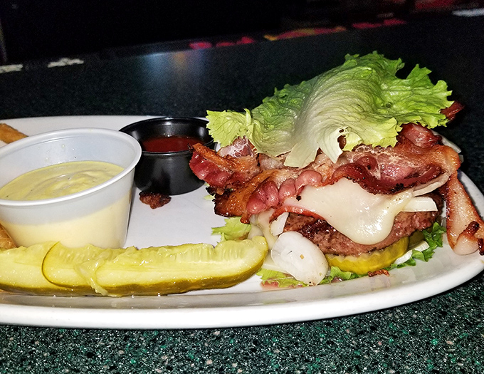 When a burger meets bacon and decides to throw a party, this is what happens. The pickle stands guard, but resistance is futile.