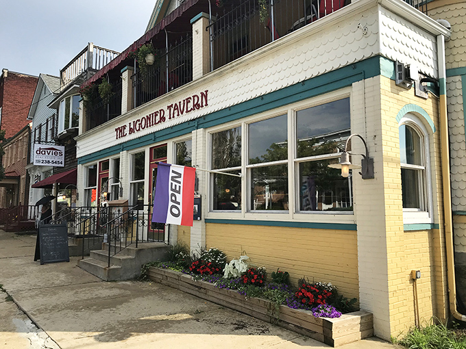 The Ligonier Tavern's cheerful yellow facade and flower boxes promise comfort food that'll make you want to text your diet coach with a breakup message. 