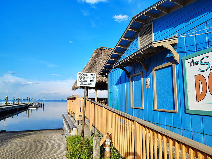 Weathered wood and vibrant blue paint create the quintessential coastal aesthetic&mdash;where seafood journeys mere yards from boat to plate.