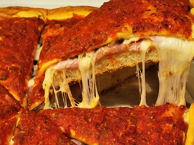 That cheese pull is performing an interpretive dance called "Why You Can't Resist Me." The crispy-edged crust is its perfect partner.