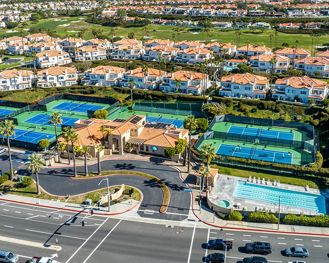 Tennis courts and swimming pools complement the coastal lifestyle in Dana Point's upscale communities, where "neighborhood amenities" takes on new meaning.