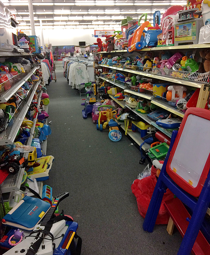 The toy aisle explodes with color, where forgotten childhoods wait to spark new memories.