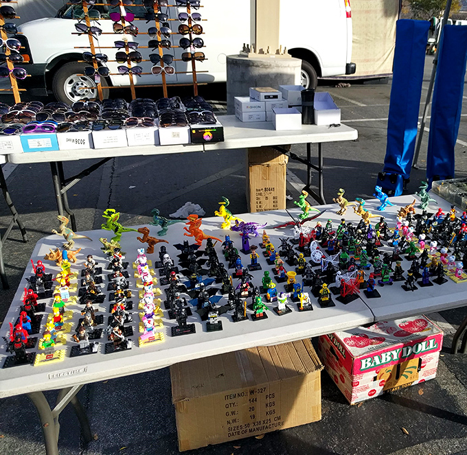 Childhood nostalgia meets bargain hunting as vintage toys and designer sunglasses share the same table.