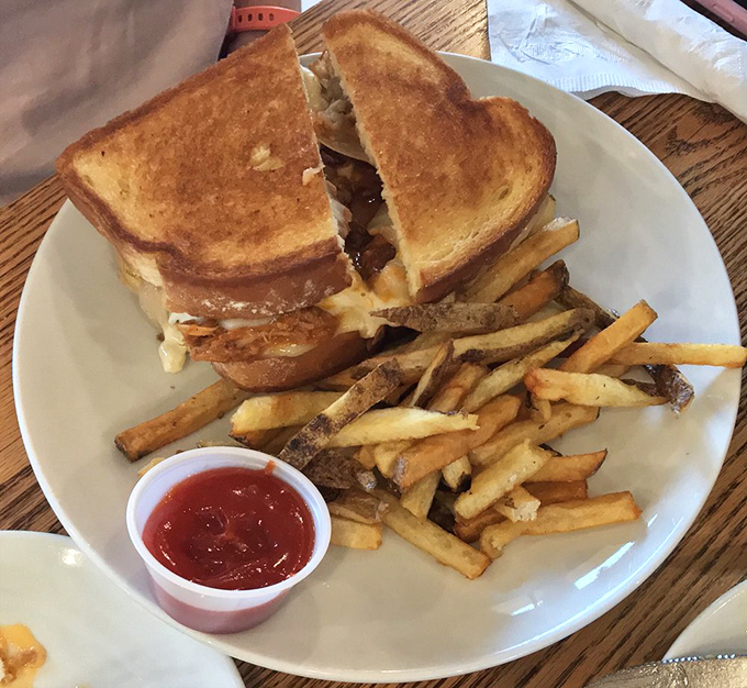The sandwich that launched a thousand road trips&mdash;perfectly grilled bread holding melty cheese and savory fillings, with fries that didn't come from a freezer.