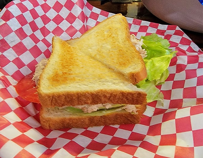 A tuna sandwich that respects tradition, nestled in a red-checkered basket that's seen thousands of satisfied smiles over the years.