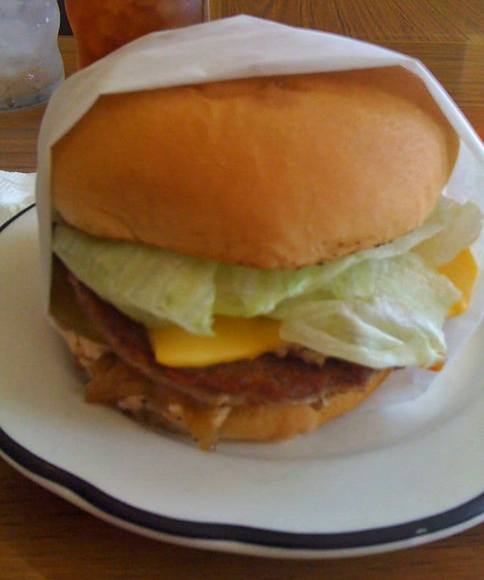 The classic cheeseburger: perfectly proportioned, no architectural challenges, just beef, cheese, and veggies in harmonious balance.