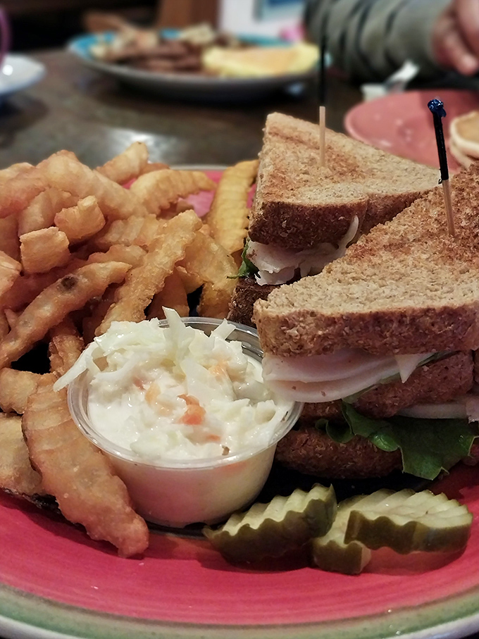 This isn't just a sandwich; it's architecture. Layers of turkey, crisp vegetables, and toasted bread create the skyscraper of lunch options.