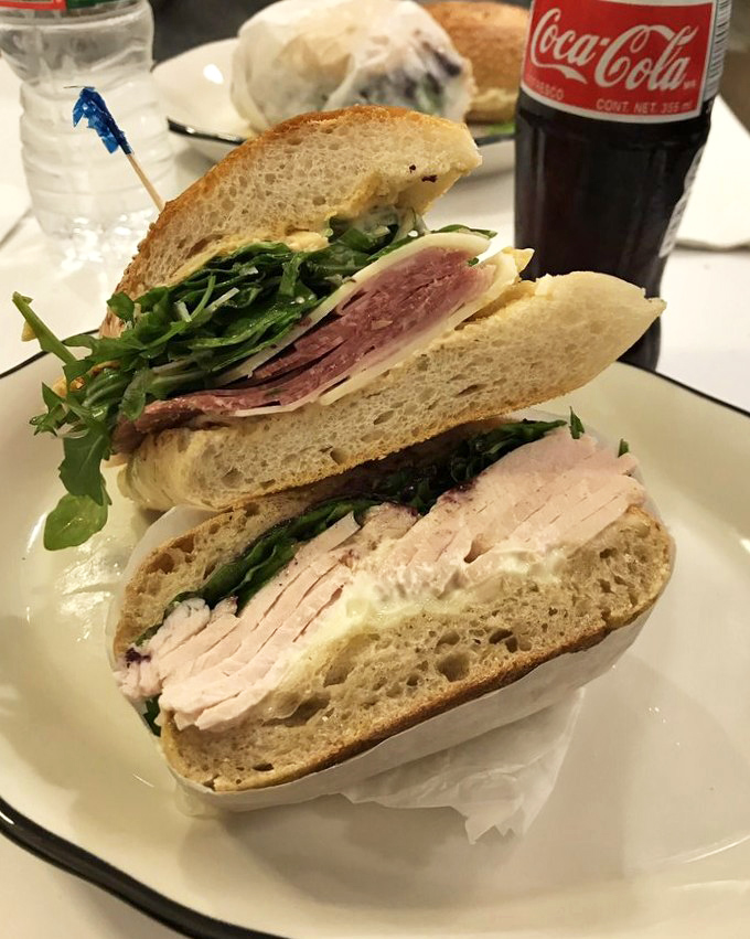 A sandwich cut in half isn't just convenient&mdash;it's a window into the soul of proper construction. Look at those layers! That's sandwich engineering at its finest.