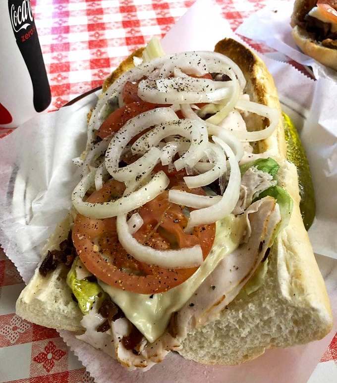 Fresh veggies piled high atop quality cold cuts – proof that sometimes the simple classics outperform all the trendy newcomers on the food scene.