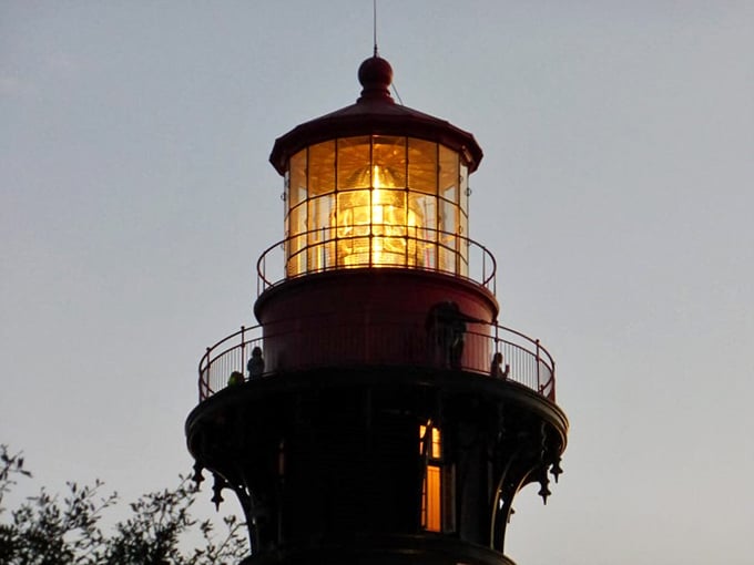 As twilight falls, the lighthouse beam springs to life, a golden sentinel that's been guiding mariners safely home for nearly 150 years.
