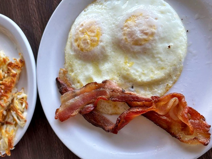 Two sunny-side up eggs with bacon that's achieved that magical state between crispy and chewy&mdash;the breakfast equivalent of hitting the lottery.