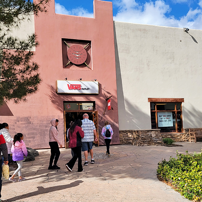The Vans store draws a crowd of shoppers hunting for California cool. That "Buy Any Shoe Get 50% Off" sign is practically a siren song.
