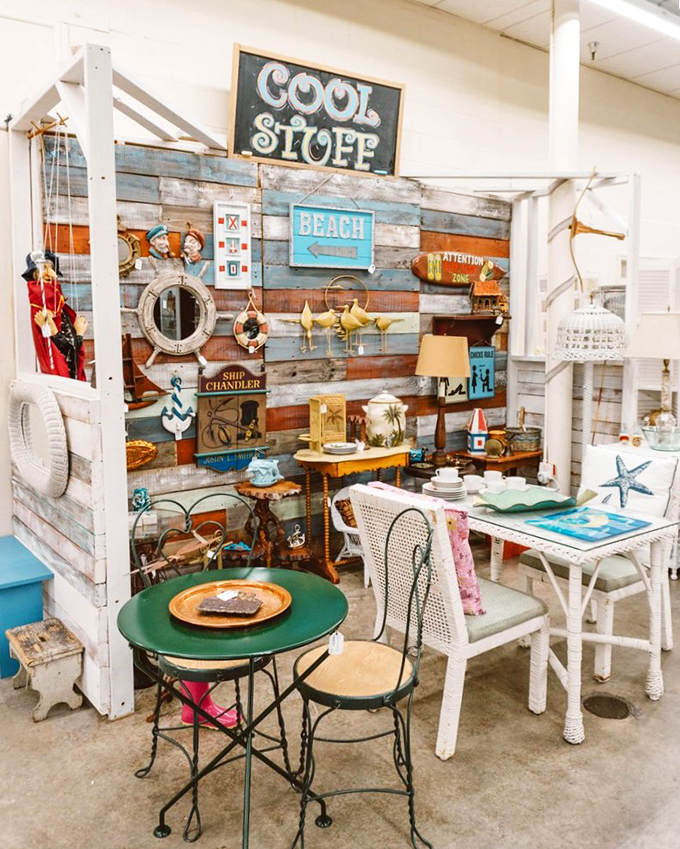 Coastal dreams come alive in this beachy booth where weathered wood, nautical accents, and that perfect bistro table create an instant Florida vacation vibe.