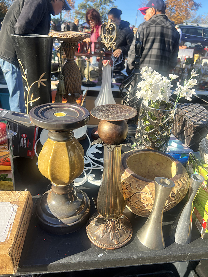 Brass, glass, and class. These vintage candleholders and vases wait patiently for someone to give them a second life on a mantelpiece.