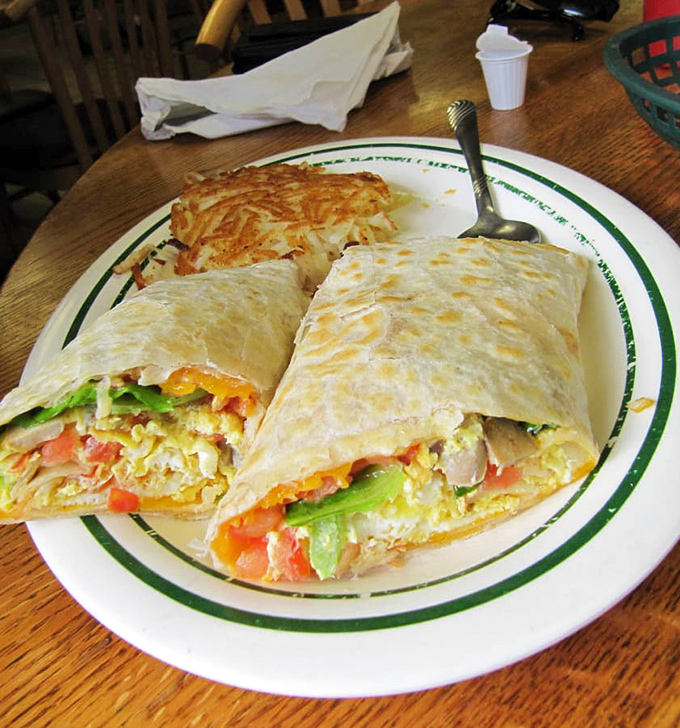 Breakfast burritos: where morning ingredients gather for a party wrapped in a warm tortilla blanket. This one's packed tighter than beach parking on a holiday weekend.