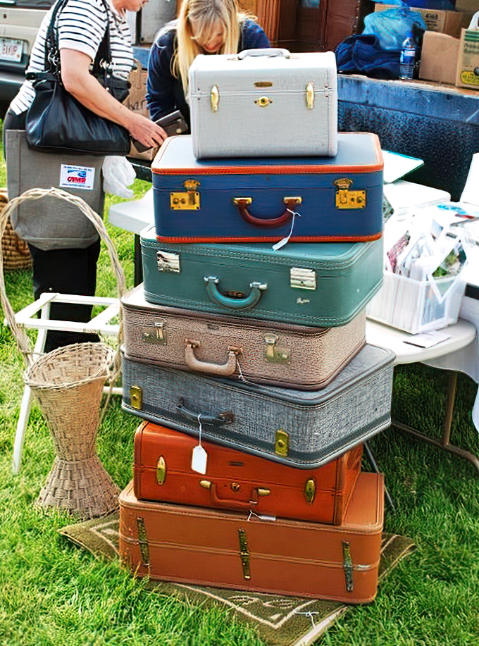 Vintage suitcases stacked like a traveler's layer cake. Each one could tell stories of honeymoons, family vacations, and journeys from another era.