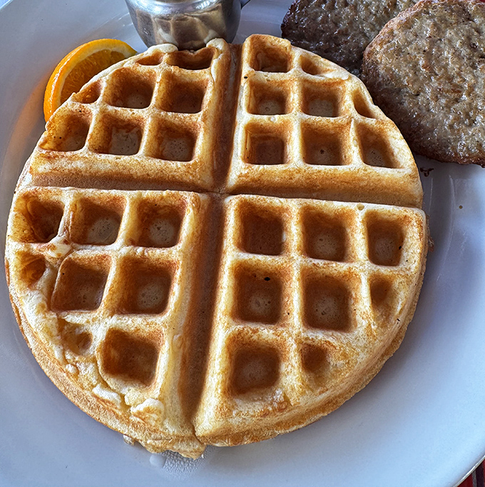 The waffle's perfect grid pattern isn't just for show&mdash;it's nature's most efficient butter and syrup delivery system. Golden, crisp, and ready for action.