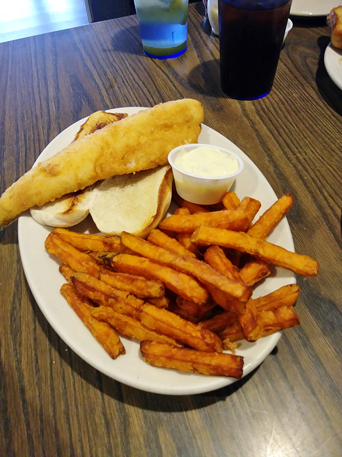 The walleye sandwich and sweet potato fries - proof that sometimes the best things in life come on a plain white plate.