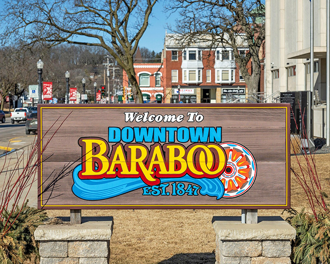 Downtown Baraboo's welcome sign promises exactly what it delivers: small-town charm with a splash of color and a side of circus history.