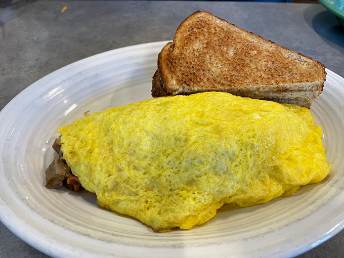 This omelet wears its sunny personality on the outside while keeping all the good stuff tucked safely inside. Toast for moral support.