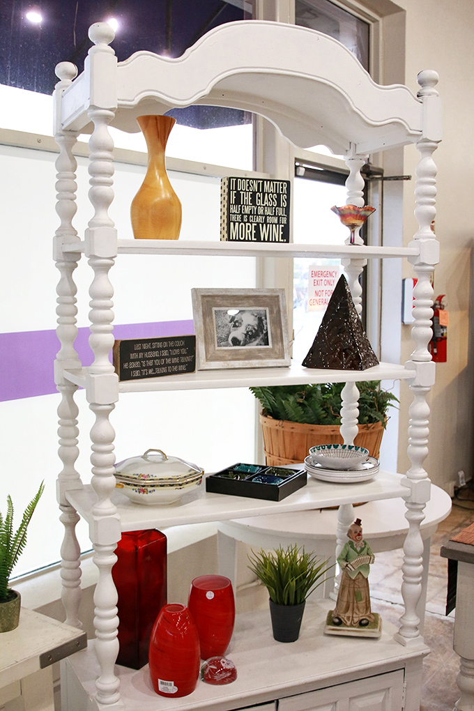 Shabby-chic perfection in pristine white. This statement shelf unit practically begs to display your treasured knick-knacks and family photos.