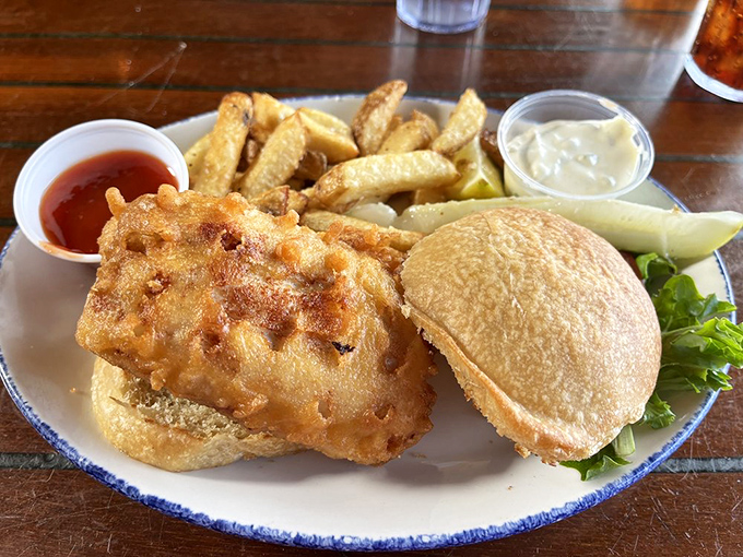 The sandwich that launched a thousand road trips. Crispy whitefish on a pillowy bun &ndash; proof that simplicity, when done right, is culinary genius.