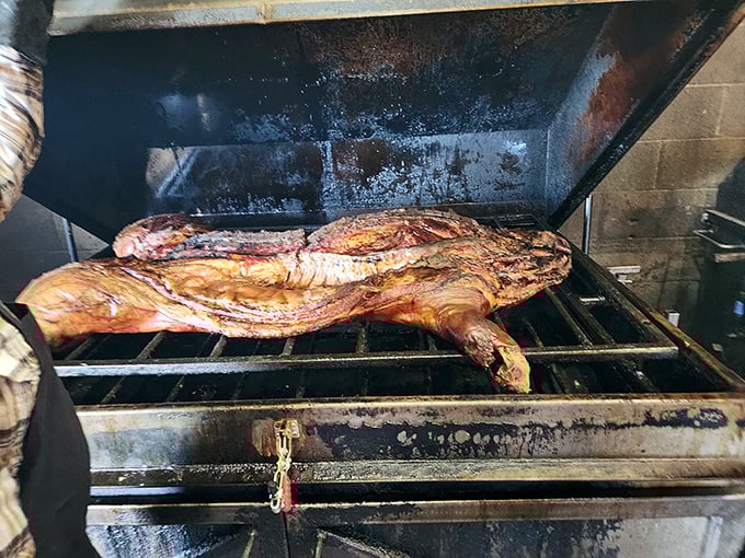 Behold the whole hog in its natural habitat&mdash;the smoker. This isn't cooking; it's a slow-motion love letter to pork.