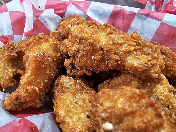 Golden-fried chicken wings that crunch louder than your diet plans breaking. These aren't just wings&mdash;they're crispy vessels of joy.