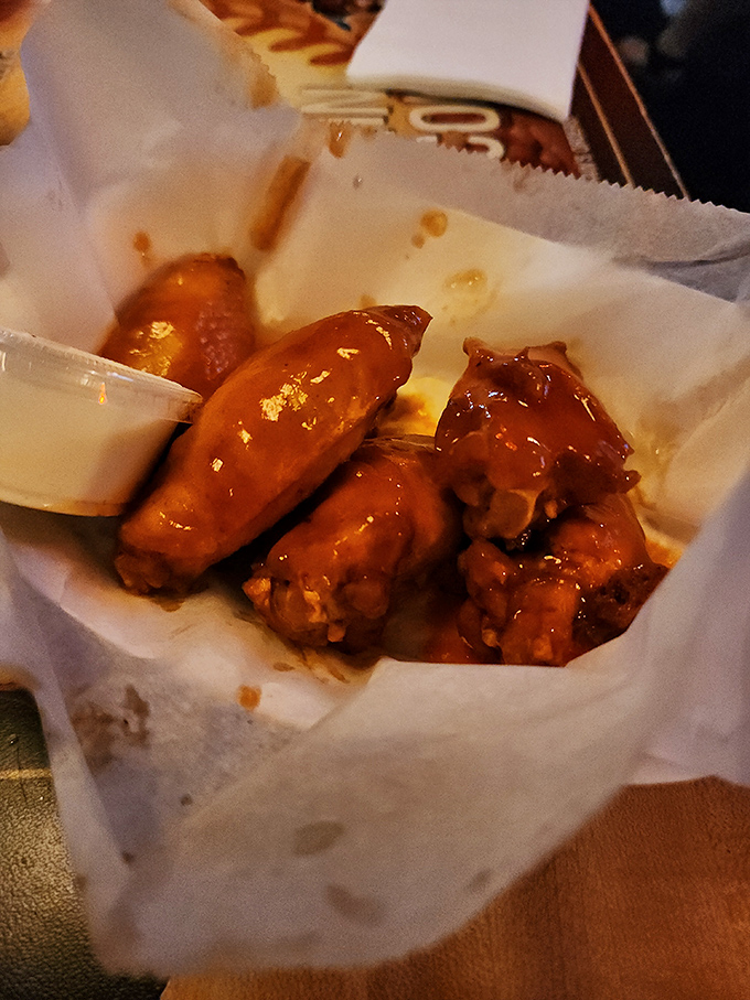 These wings aren't messing around. Glazed with what appears to be their BBQ sauce, they're the kind of appetizer that becomes the main event.