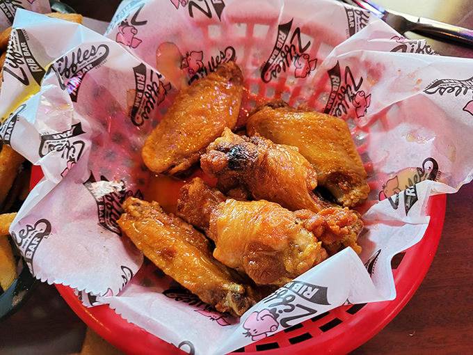 These wings aren't just cooked&mdash;they're transformed. Glistening with sauce and nestled in their basket, they're practically begging you to abandon all utensils and dignity.