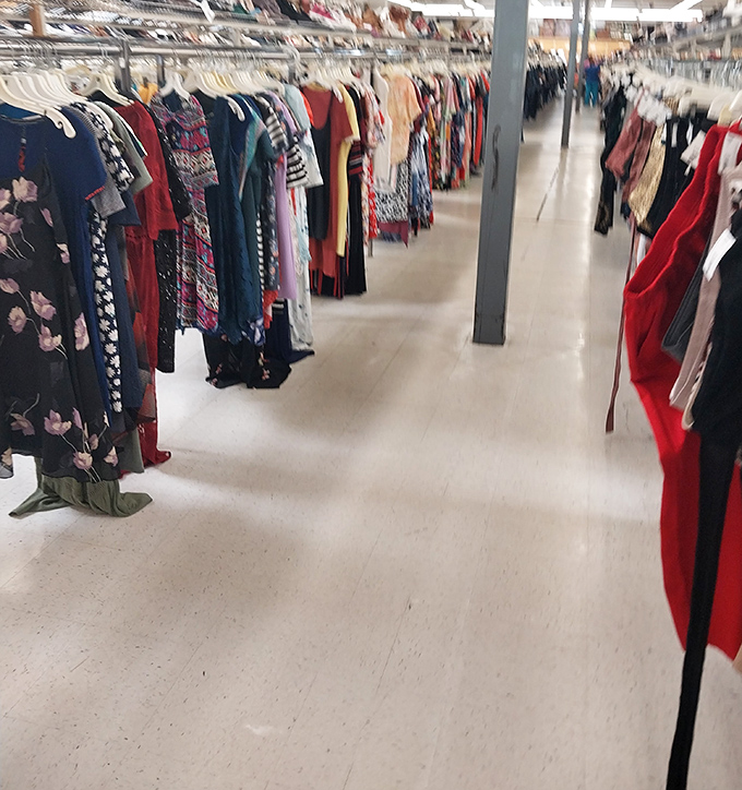 Racks upon racks of women's clothing create a textile maze where fashion treasures from every decade hide in plain sight.