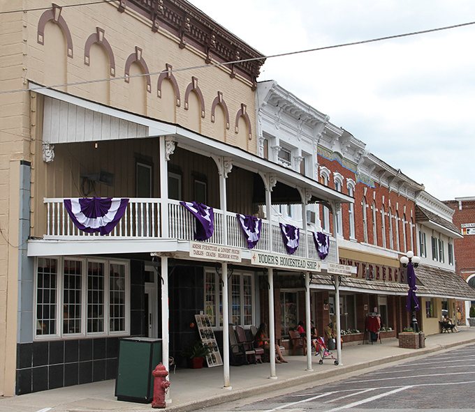 Yoder's Homestead Shop offers authentic Amish-made goods beneath charming purple bunting, a testament to the area's living cultural heritage. 