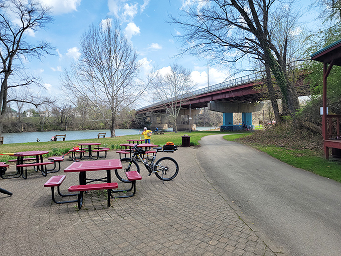 Riverside picnic tables await cyclists and locals alike&mdash;proof that sometimes the best restaurant has no walls, just views.