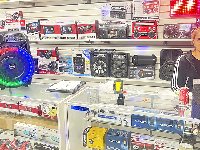 A wall of sound systems that would make any 80s kid nostalgic—boomboxes and speakers ready to blast your life's soundtrack.