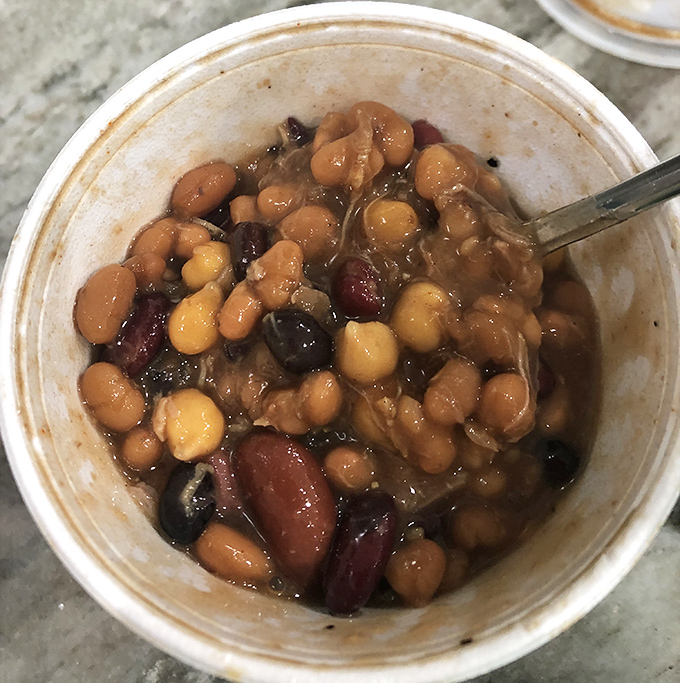 Baked beans that blur the line between side dish and main event. Each spoonful is a treasure hunt of multiple bean varieties and smoky meat morsels.