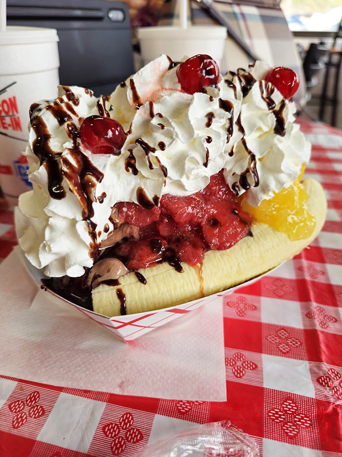 Not just a banana split&mdash;it's a architectural marvel of dairy engineering topped with enough whipped cream to make a cloud jealous.
