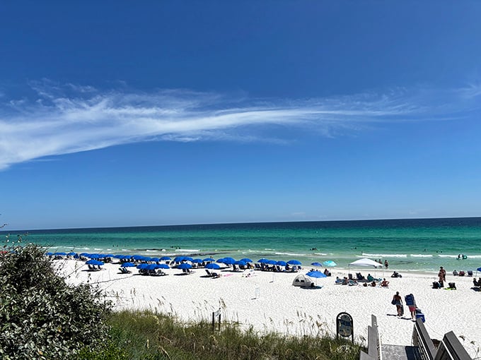 That moment when the boardwalk opens to reveal Rosemary Beach's greatest treasure: sugar-white sands meeting emerald waters under an impossibly blue sky.