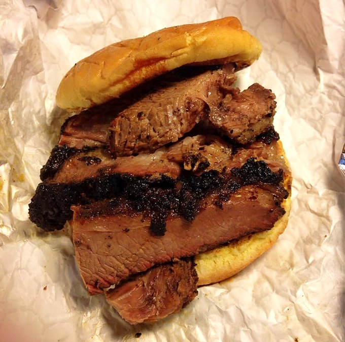 Brisket sandwich perfection &ndash; that smoke ring is like nature's way of saying "you're welcome" to your taste buds.