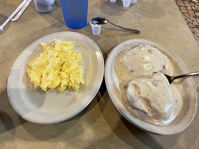 Biscuits and gravy alongside scrambled eggs&mdash;the breakfast equivalent of a warm blanket on a chilly morning. Nap scheduling recommended.
