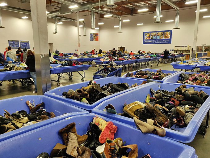 The shoe bin safari in full swing. Somewhere in this footwear jungle lurks the perfect pair of barely-worn boots waiting for their Cinderella moment.