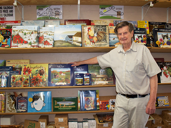 Calendars and books line shelves in perfect rows, waiting for someone to take them home and discover worlds between their covers.