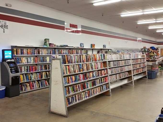 Paperback time machines lined up for the taking. Each spine represents someone else's literary journey, ready for new eyes. 