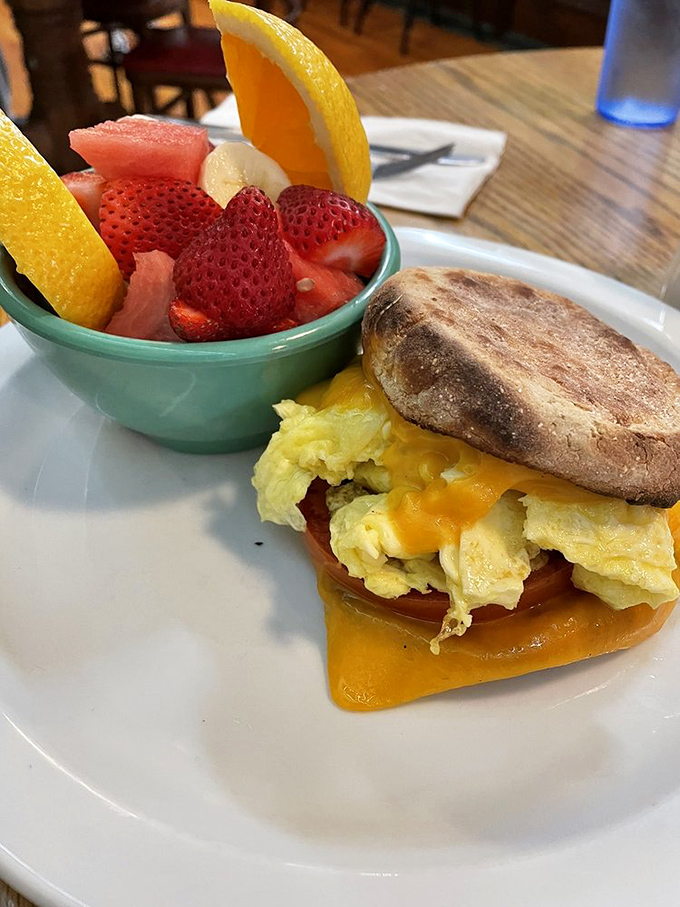 The breakfast sandwich and fresh fruit bowl&mdash;proof that sometimes the simplest combinations create the most profound happiness.