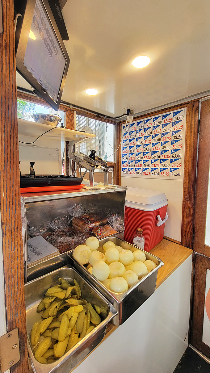 Inside the wagon, every inch tells a story. Those peeled onions and prepped buns are the supporting actors in Ohio's longest-running food show.