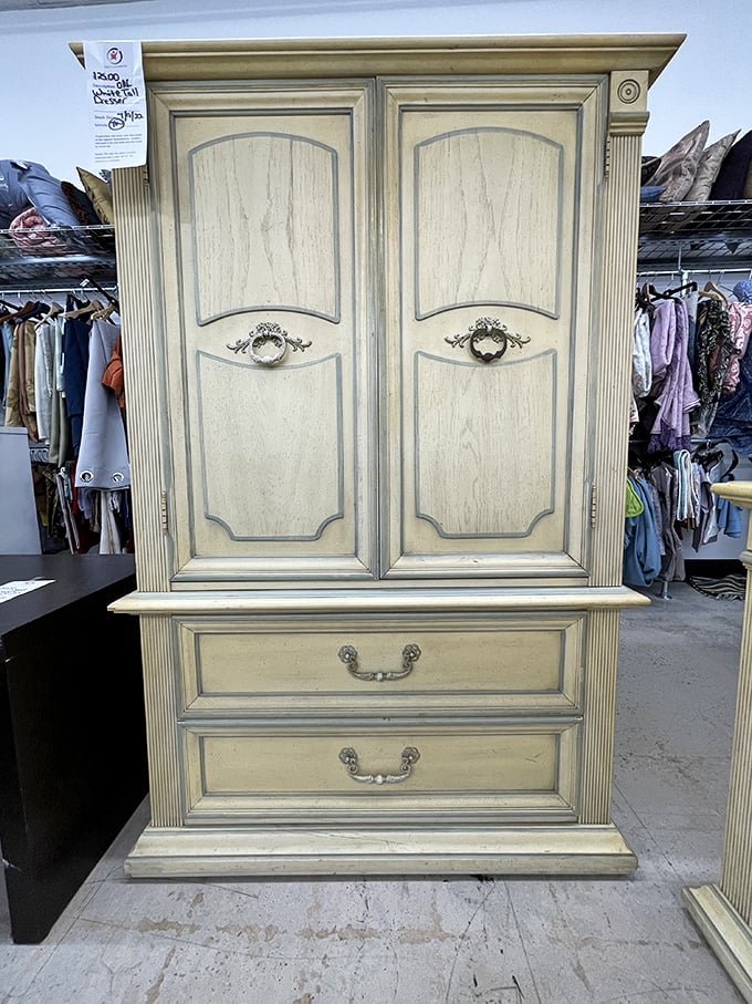 A cream-colored armoire that whispers tales of elegant bedrooms past, now waiting for its next chapter in your home.