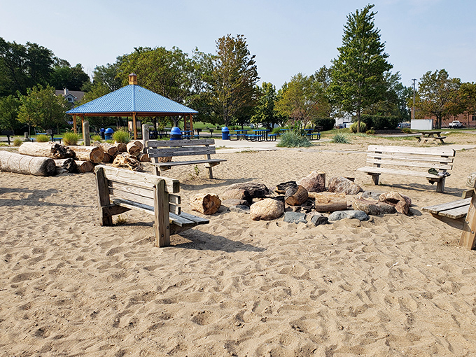 Wooden benches circle this beachside fire pit, where strangers become friends and marshmallows become s'mores under star-filled Lake Erie skies.