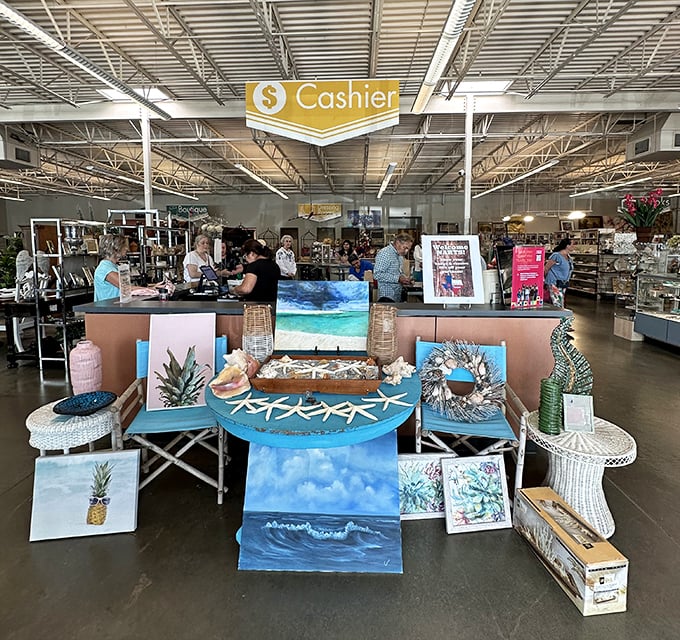 The bustling checkout area, where beach-themed art meets eager bargain hunters ready to claim their newfound treasures.
