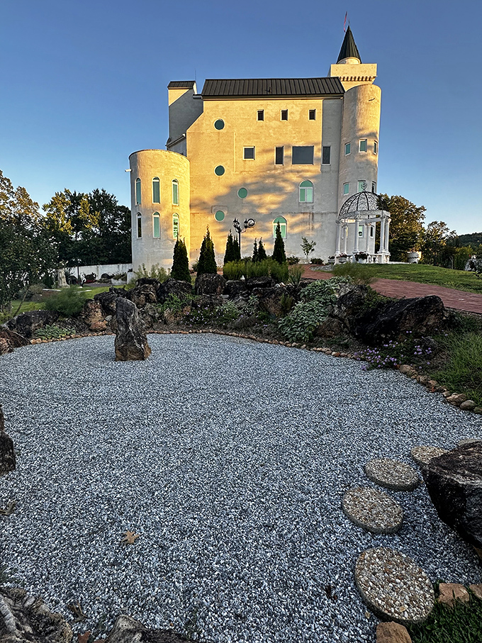 Golden hour transforms the white walls into a canvas of warm light, proving that even castles enjoy a good sunset selfie.