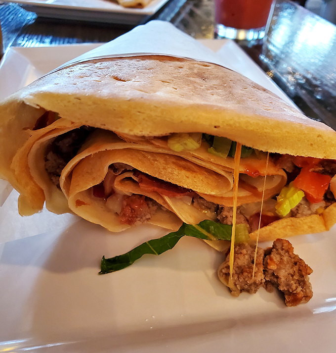 Who needs a bun when you've got a crepe? This handheld masterpiece proves that burgers and French pancakes were destined to meet.